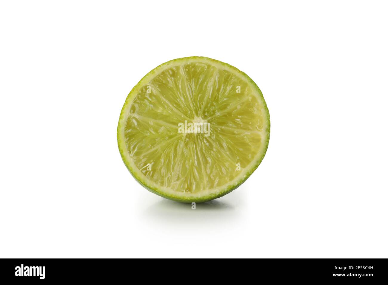 Half of ripe lime isolated on white background Stock Photo - Alamy