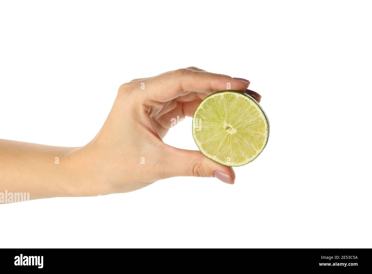 Female hand hold half of lime, isolated on white background Stock Photo ...