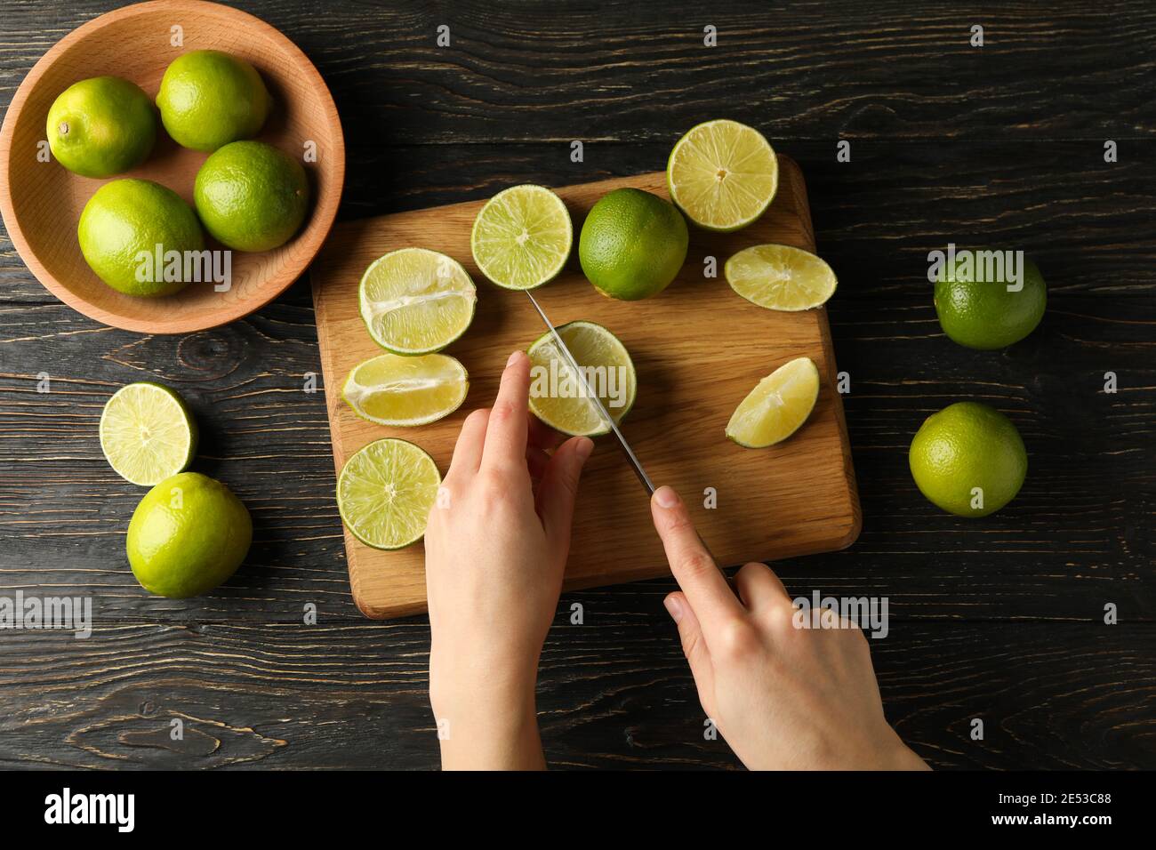 Female cutting lime on board hi-res stock photography and images - Alamy