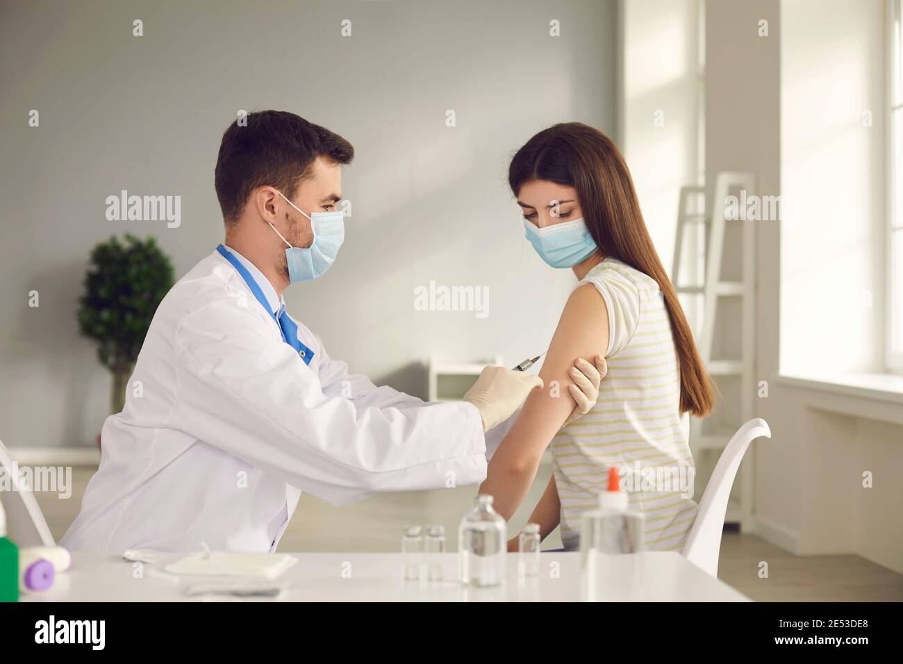 Nurse giving male patient injection hi-res stock photography and images ...