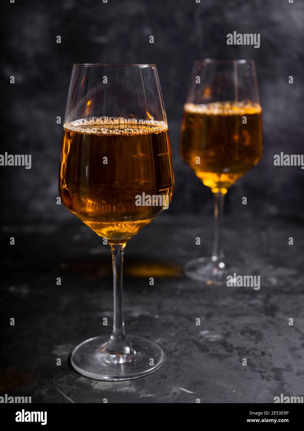 amber or orange wine made from white grapes. in a tall wine glass ...