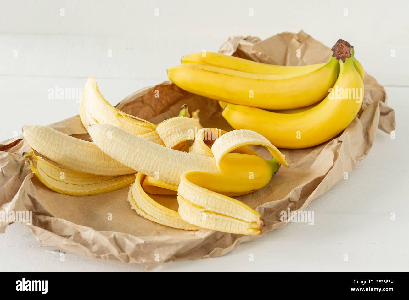 Ripe bunch of bananas in paper bag. Healthy eating concept Stock Photo ...