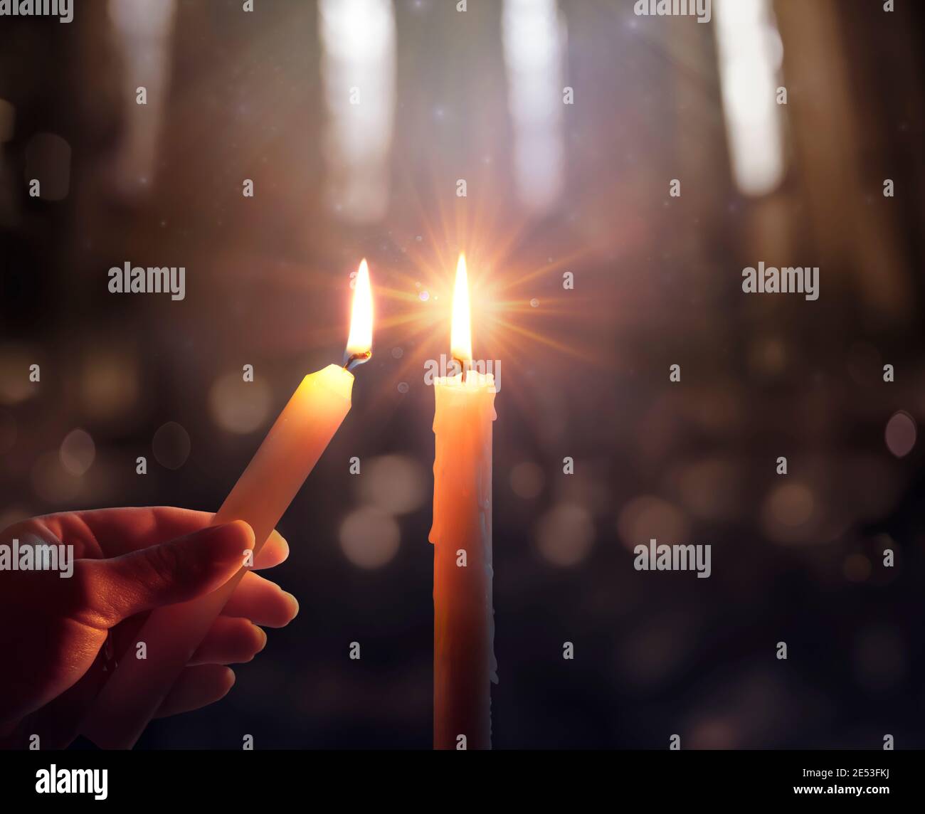 Defocused Hope Concept - Hand Igniting A Candle With Shining Flame And ...