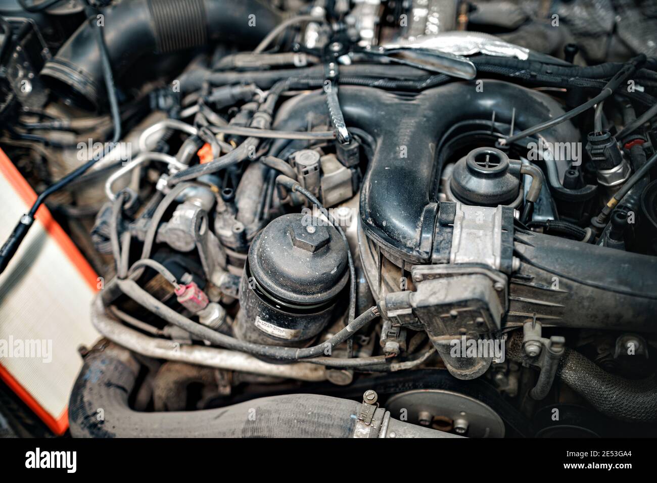 Dirty engine under the hood of a car Stock Photo - Alamy