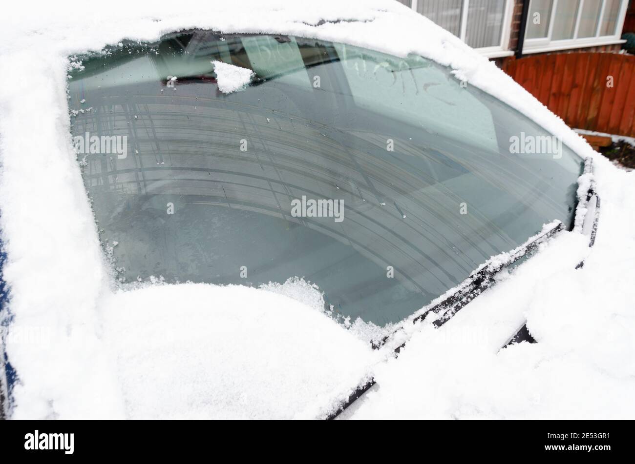 Snow cleared from a car windscreen by operating the wipers Stock Photo ...