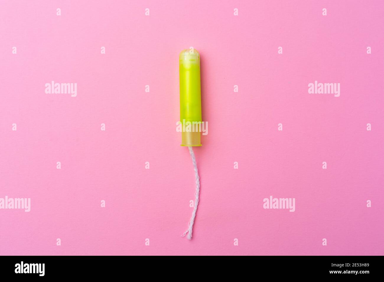 Hygienic female tampon on a pink background Stock Photo - Alamy