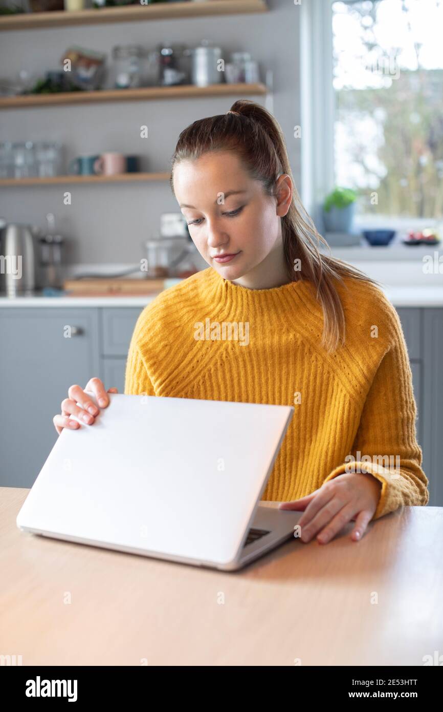 Person at home closing laptop hi-res stock photography and images - Alamy
