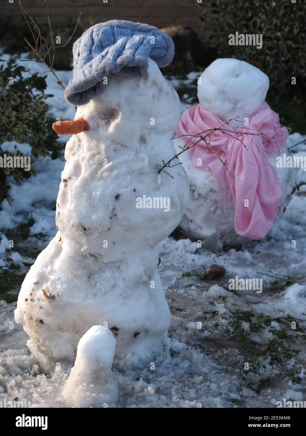 Cute snowman built by children Stock Photo - Alamy