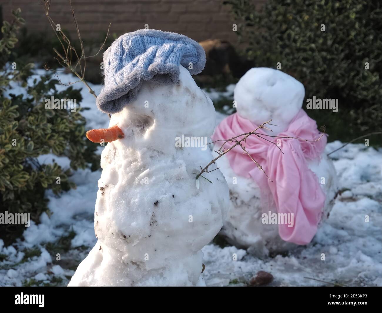 Cute snowman built by children Stock Photo - Alamy