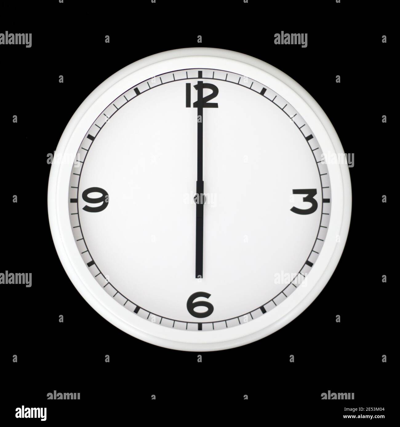 White round analog wall clock isolated on black background, its six ...