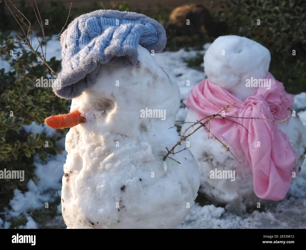 Cute snowman built by children Stock Photo - Alamy