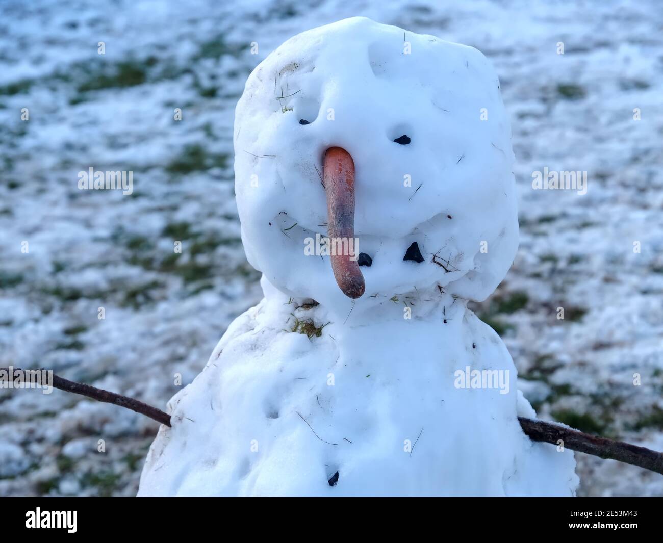 Cute snowman built by children Stock Photo - Alamy