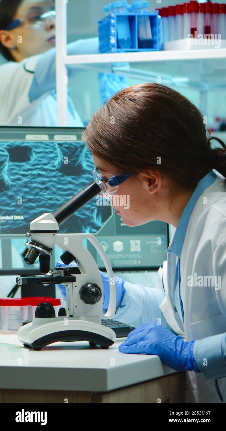 Microbiologist working late at night for new vaccine in modern ...