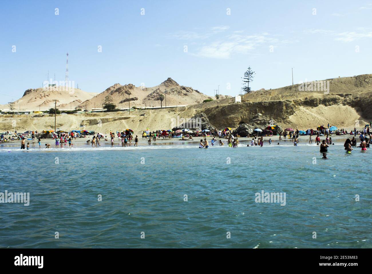 SAN JUAN DE MARCONA, PERU - Jan 15, 2015: Numerous bathers entering the ...