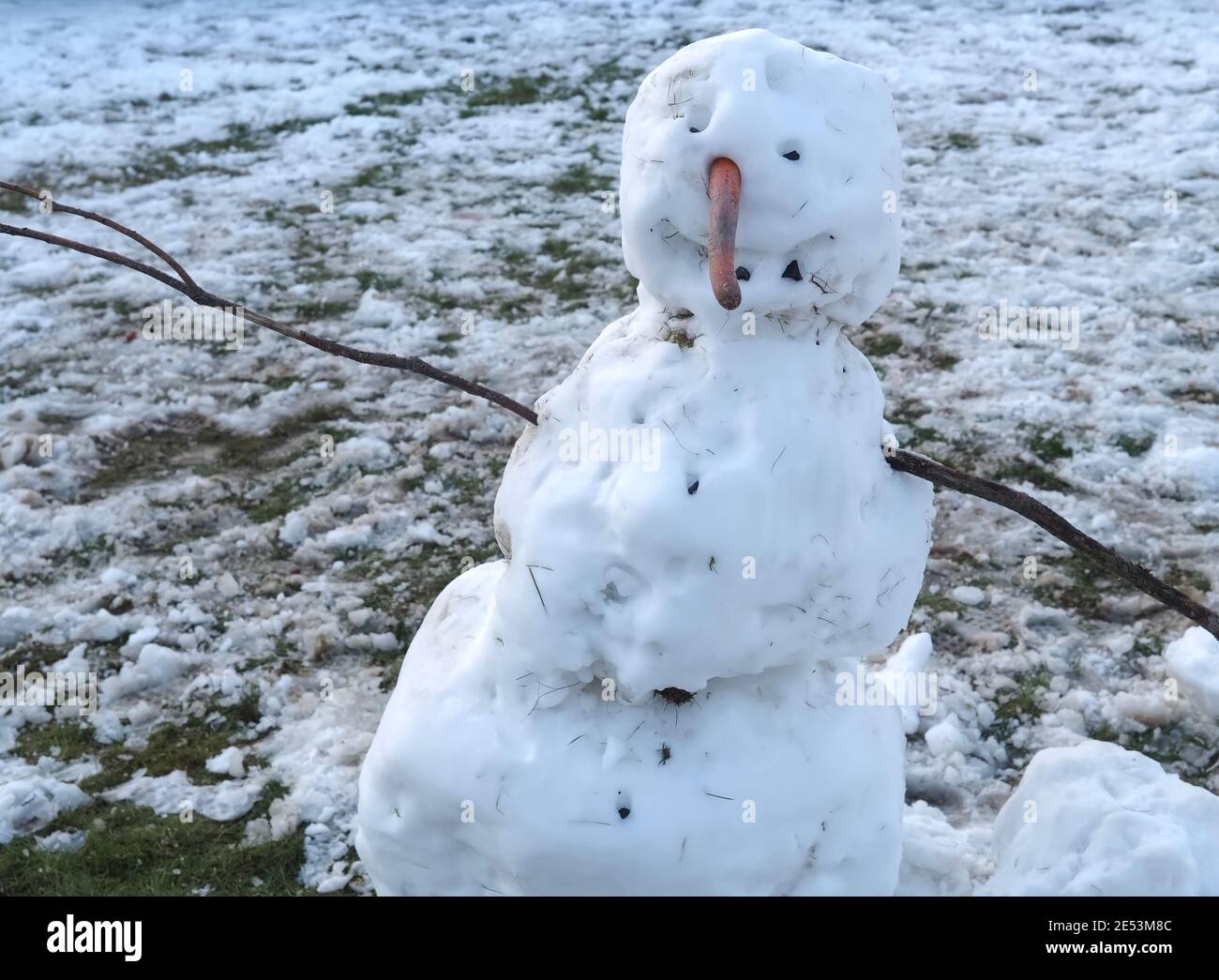Cute snowman built by children Stock Photo - Alamy