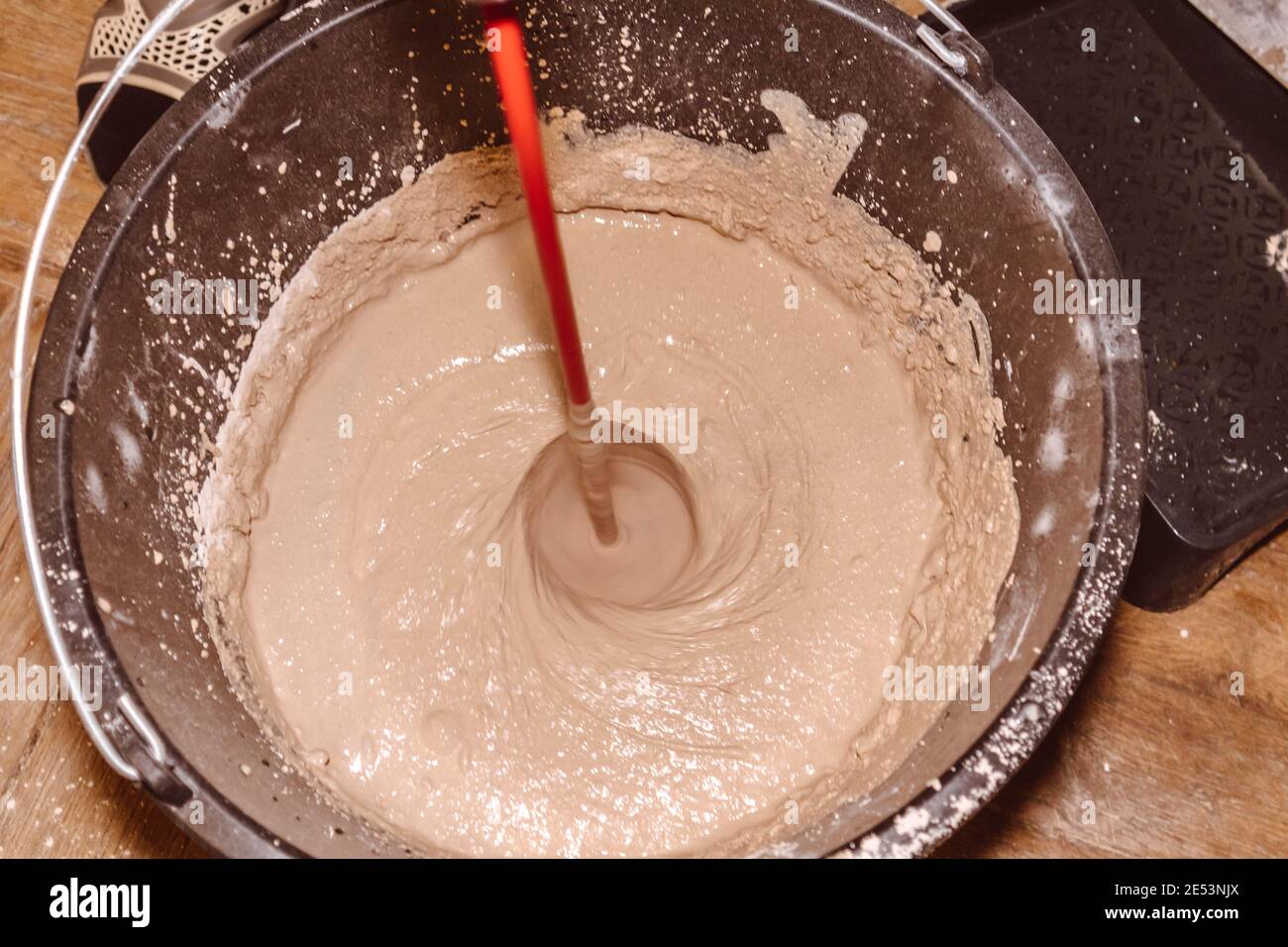 preparing a mortar plaster stirring mix water consistency emulsion ...