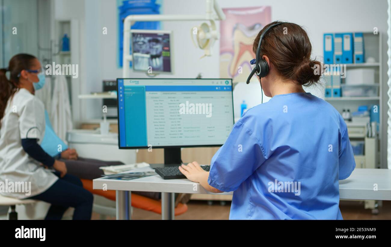 Dentist assistant making appointments hi-res stock photography and ...