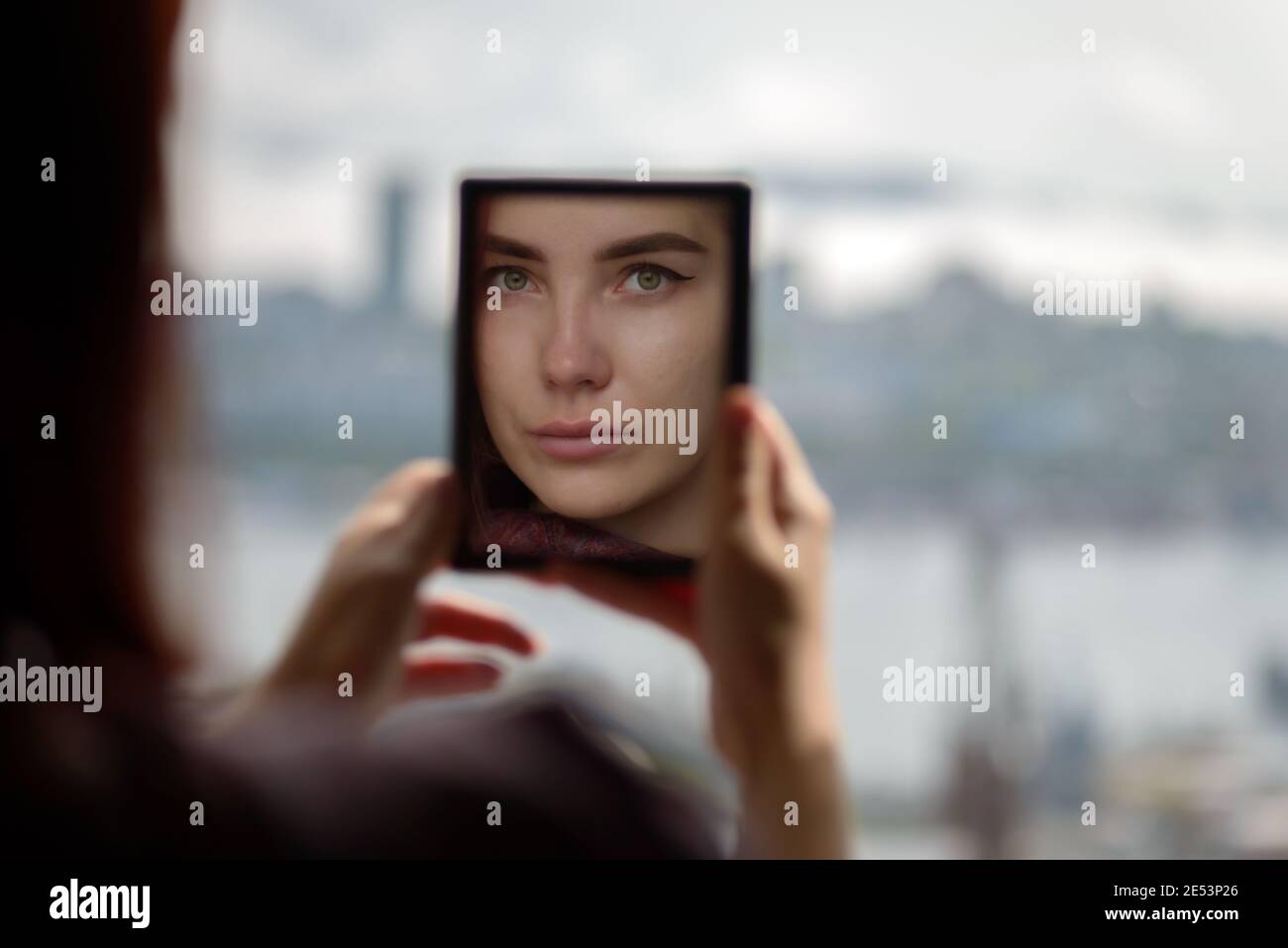 Woman looking at eyes mirror hi-res stock photography and images - Alamy