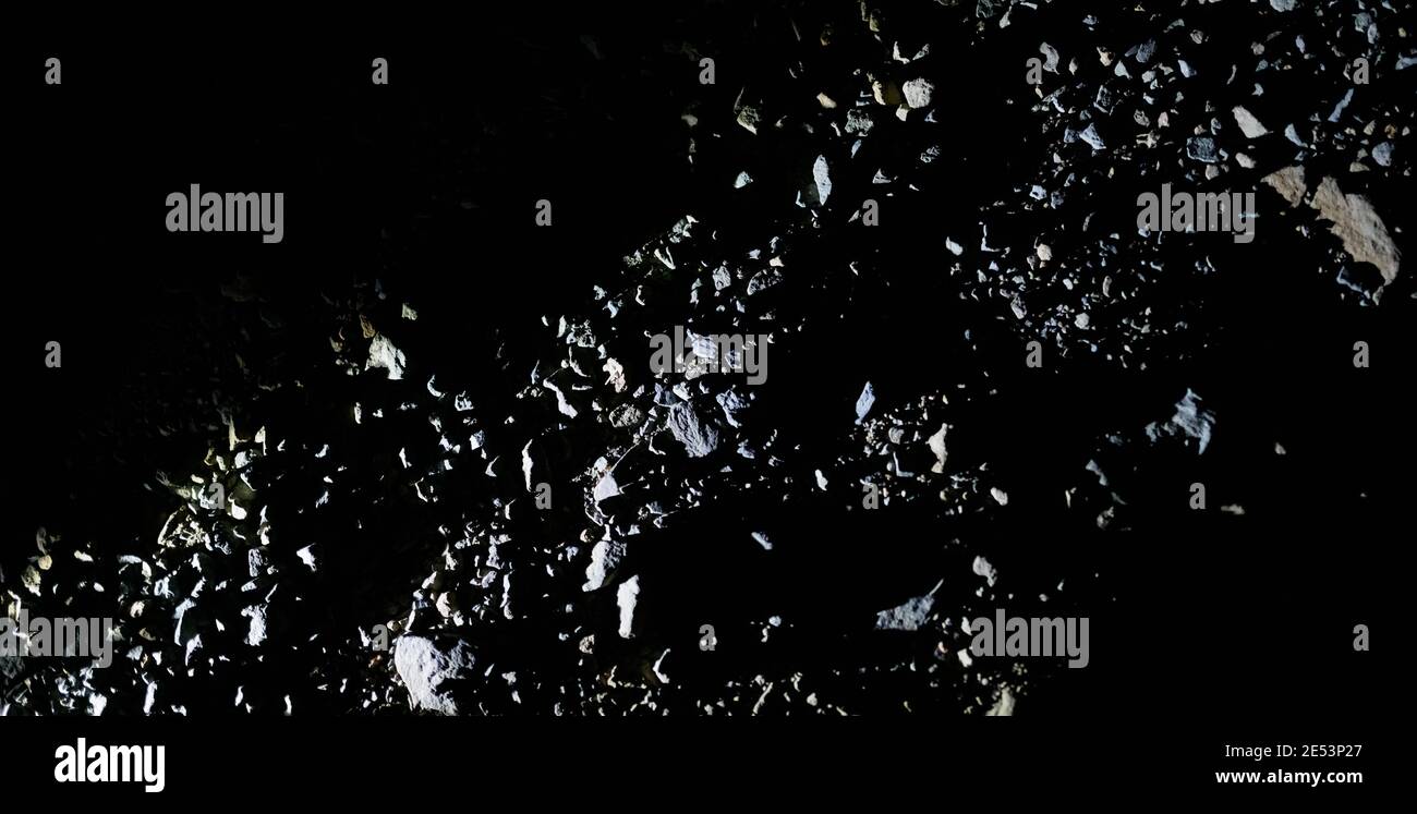 Light with bright projection on dark small stones surface Stock Photo ...