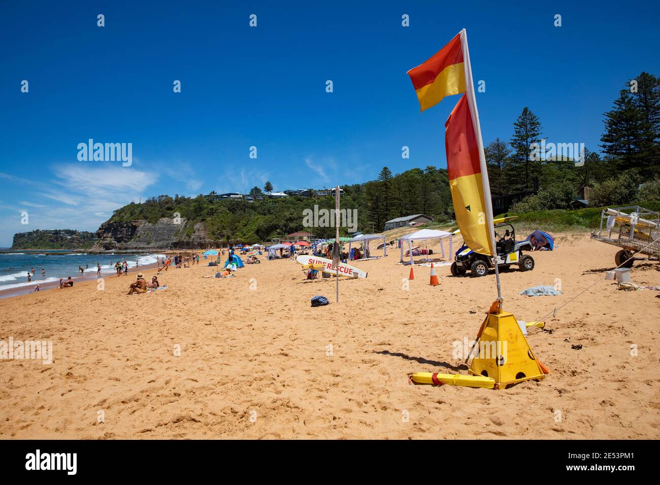 Red and yellow surf rescue flags banners on Bilgola Beach identifying ...