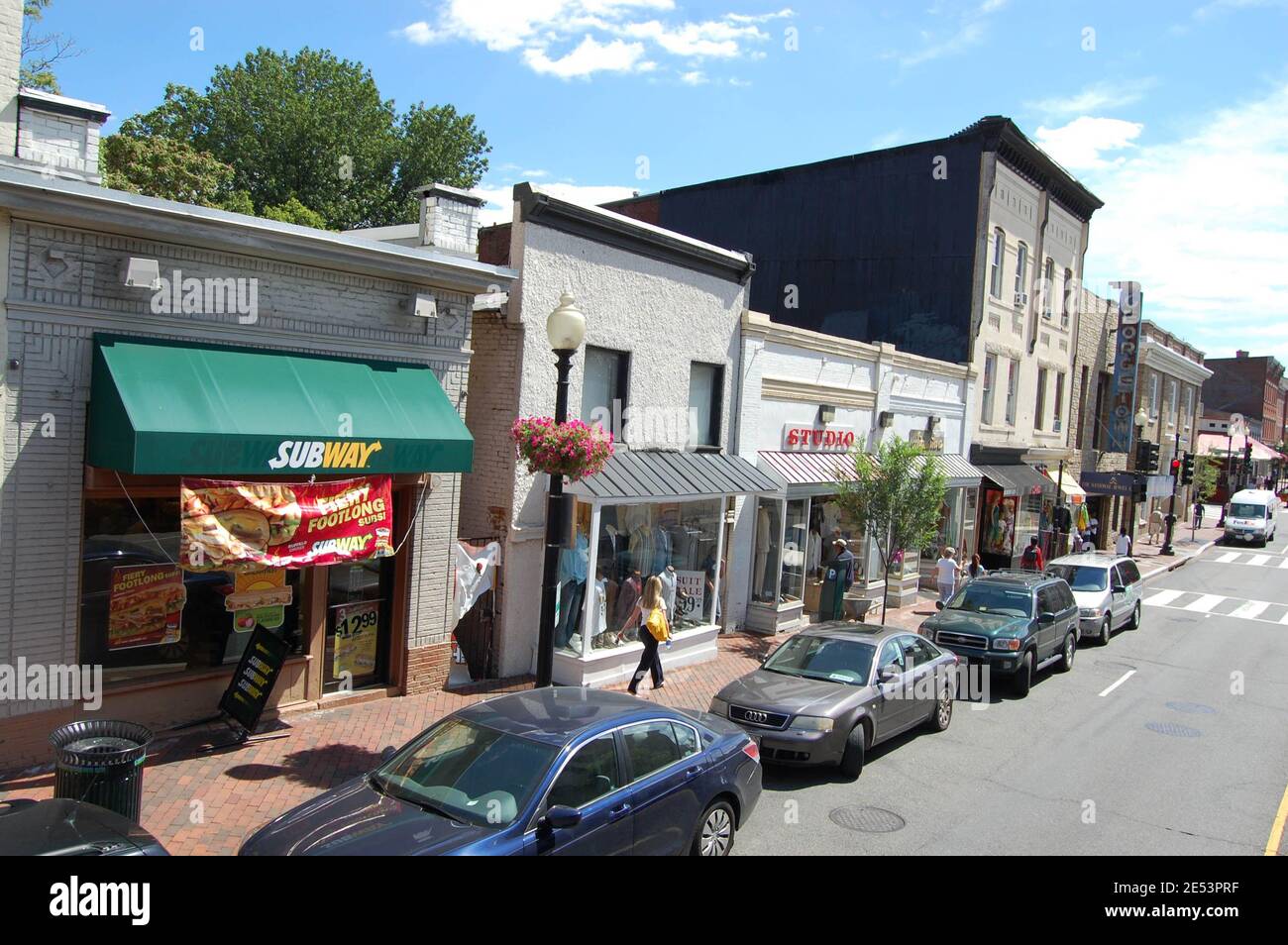 Subway food outlet shop car cars people shopping town City old style ...
