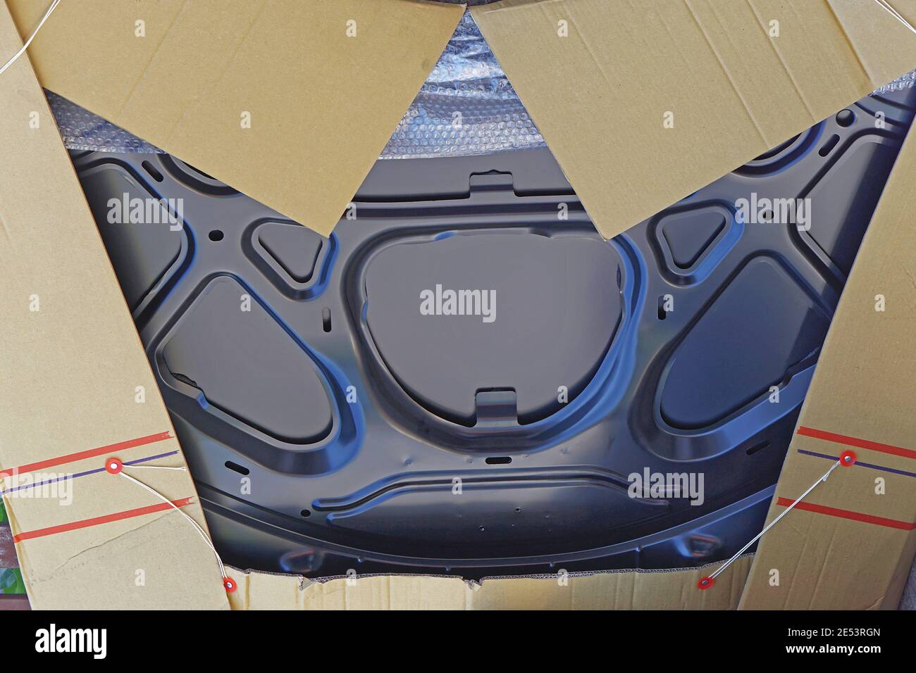 New hood car part deliver in cardboard box package Stock Photo - Alamy