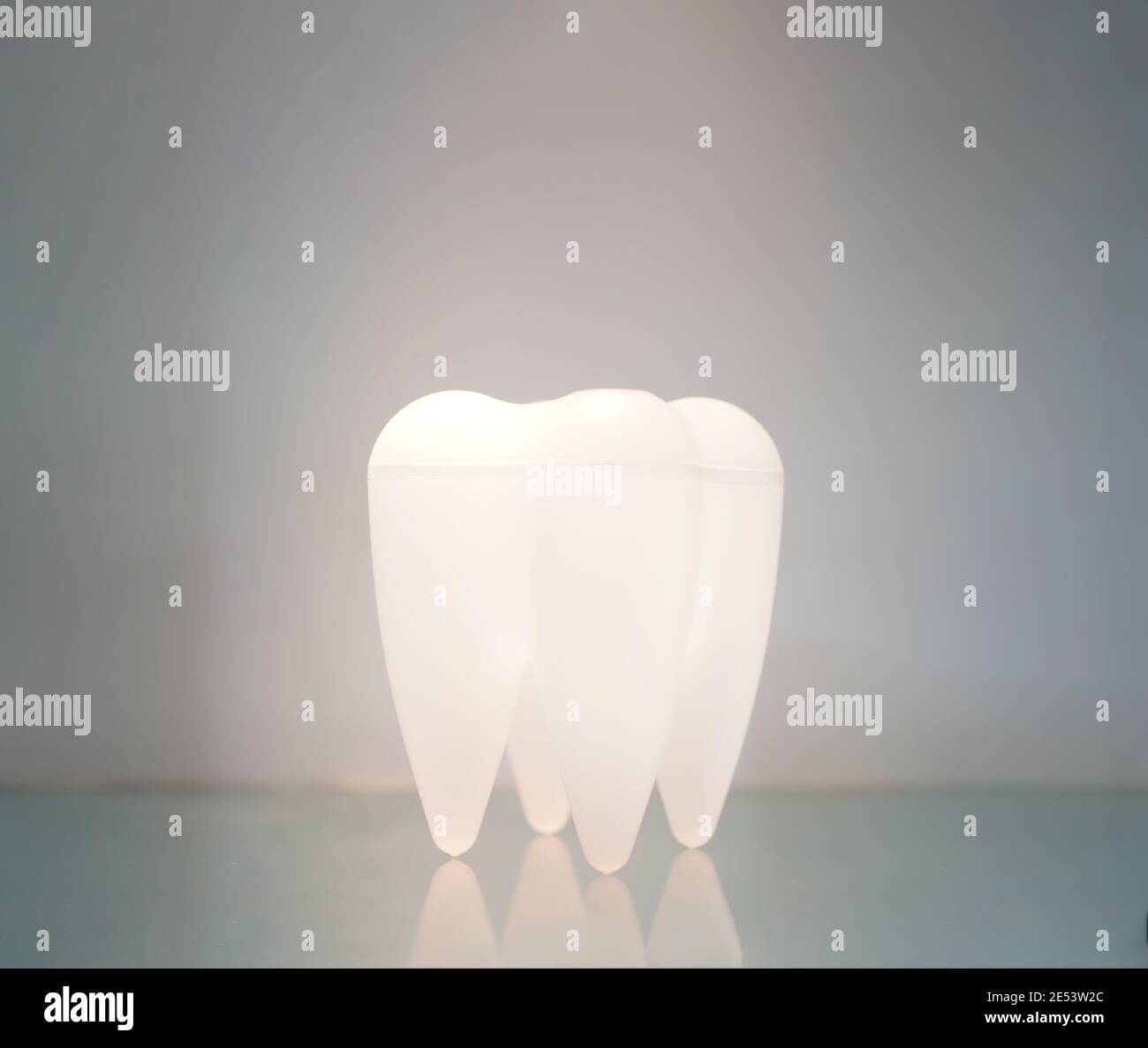 Teeth lamp stand on the mirror ground Stock Photo - Alamy