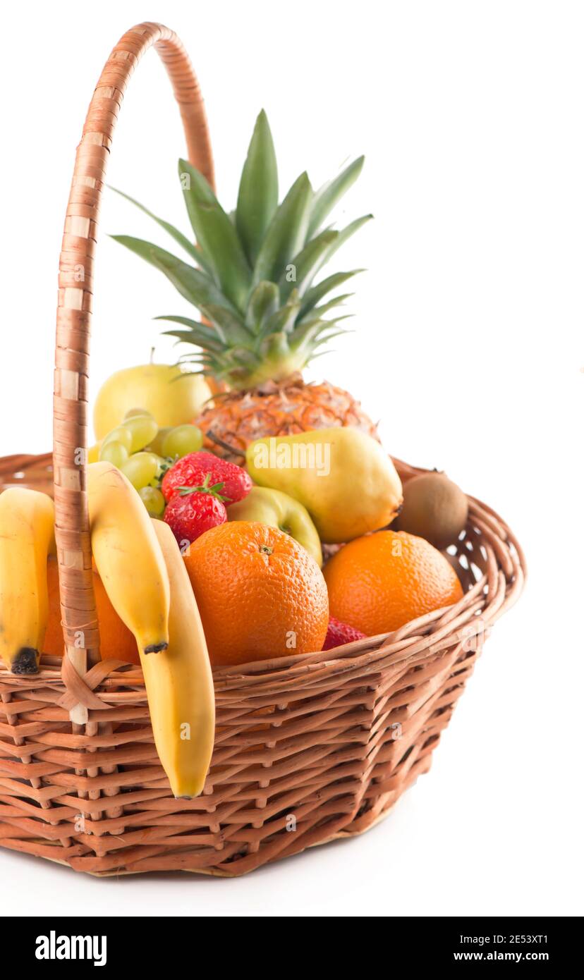 Fresh fruit in the basket against a white background Stock Photo - Alamy