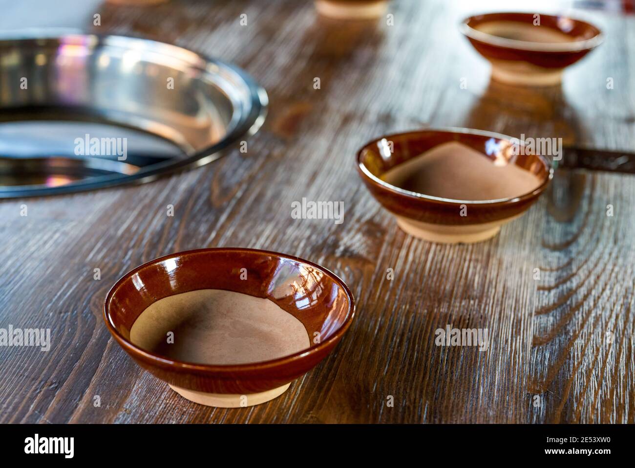 Ceramic bowl on the dining table for hot pot Stock Photo - Alamy