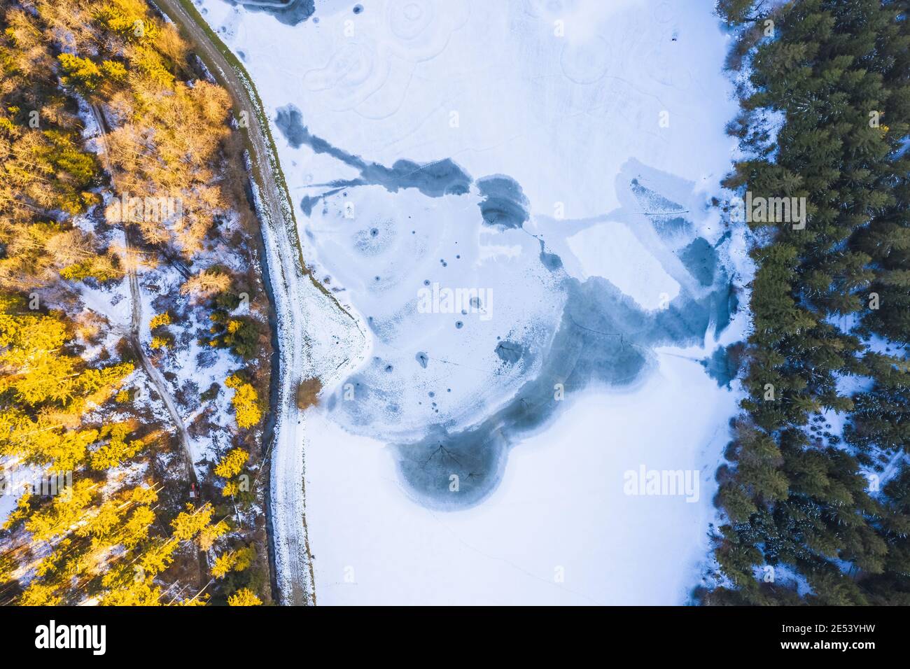 Aerial view of frozen lake. Aerial photography during winter season ...