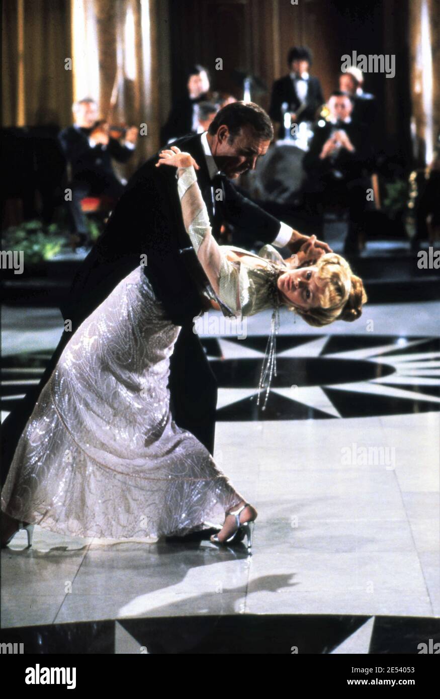 SEAN CONNERY as James Bond 007 and KIM BASINGER as Domino dancing in ...