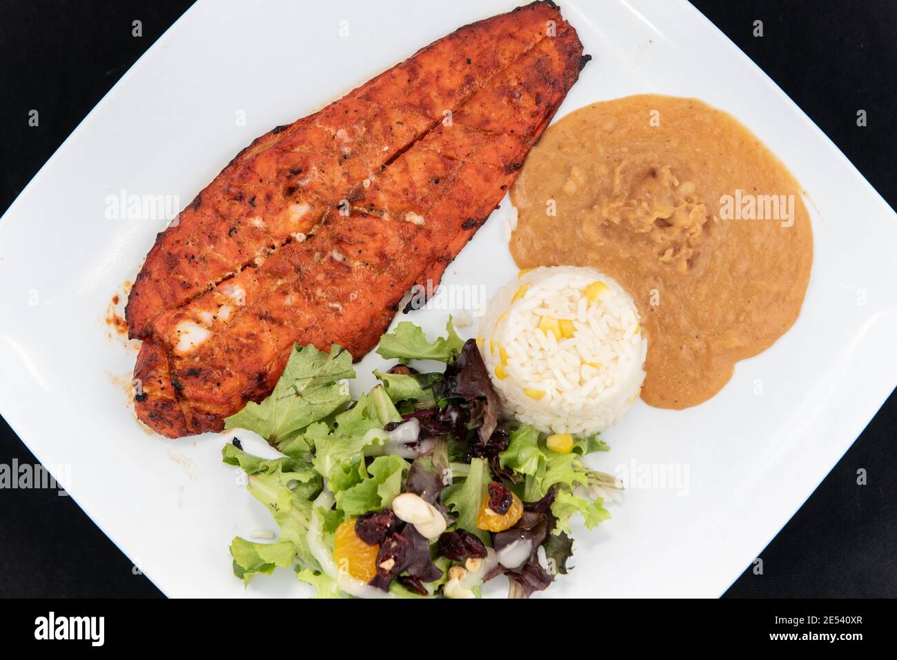 Overhead view of zarandeado fillet fish split in half in the ...