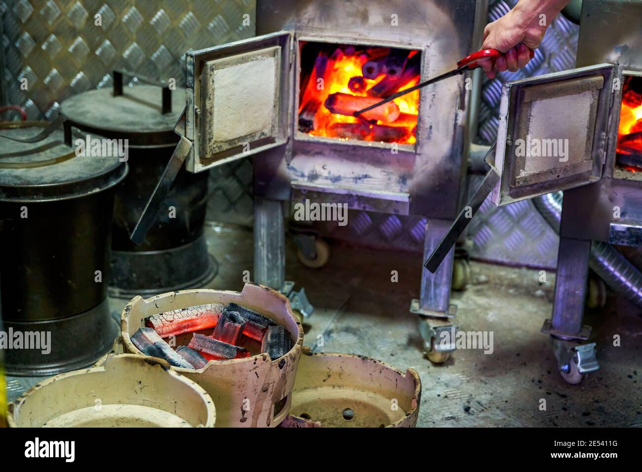 Burning charcoal fire and carbon stove Stock Photo - Alamy