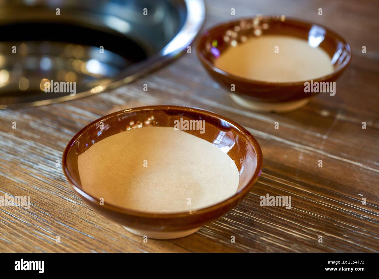 Ceramic bowl on the dining table for hot pot Stock Photo - Alamy