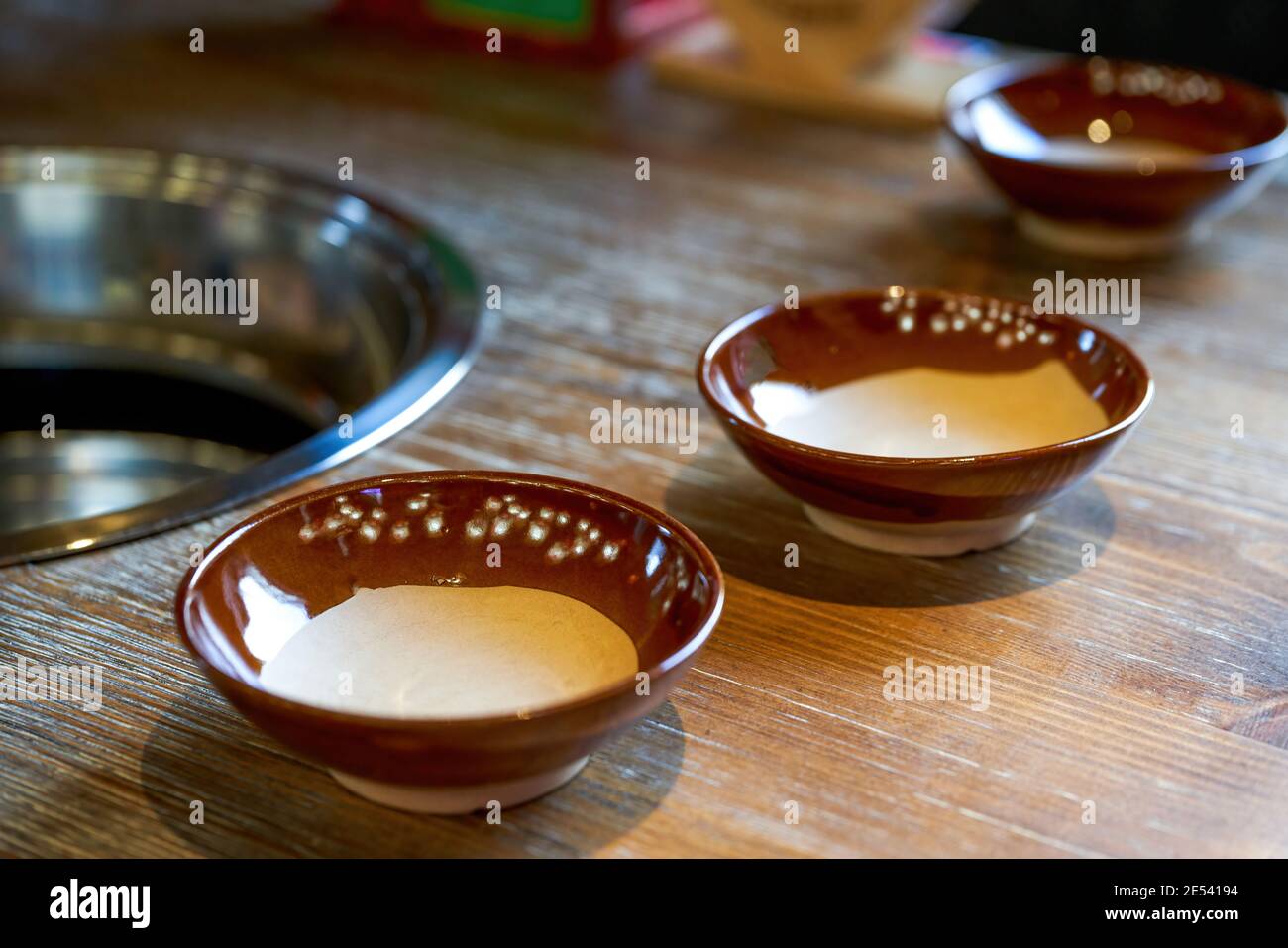 Ceramic bowl on the dining table for hot pot Stock Photo - Alamy