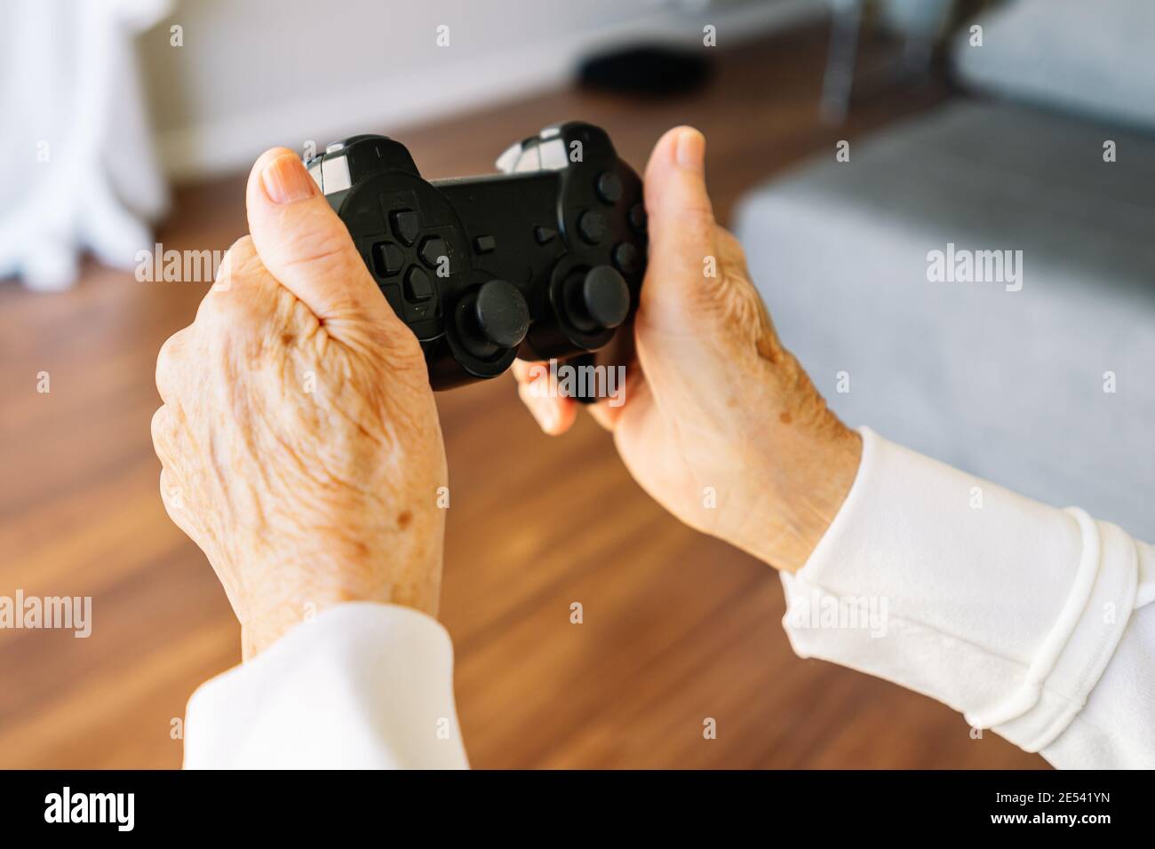 Older person playing a computer game hi-res stock photography and ...