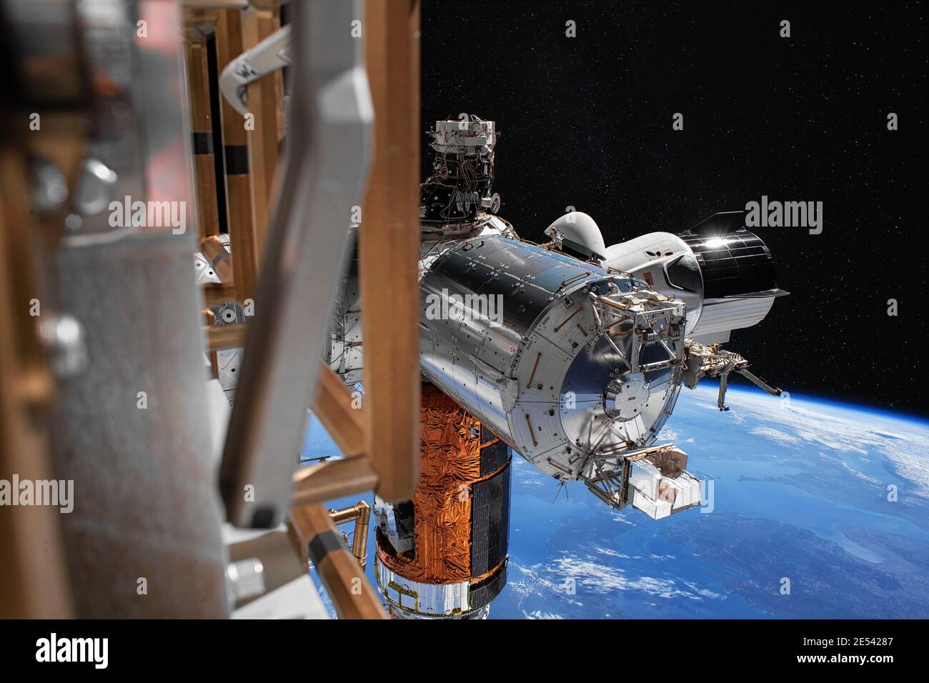 The SpaceX Crew Dragon spacecraft is docked to the International Space ...