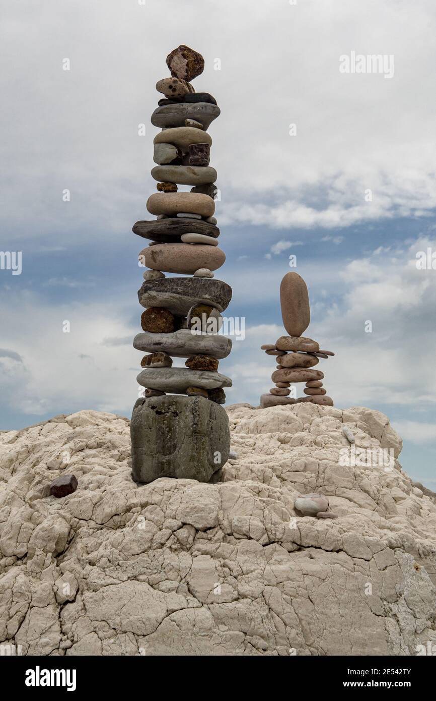 Vertical shot of balanced rocks artworks on the beach Stock Photo - Alamy