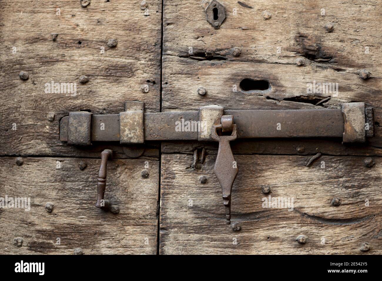 Closeup shot of an ancient metal lock on the 16th-century wooden door ...