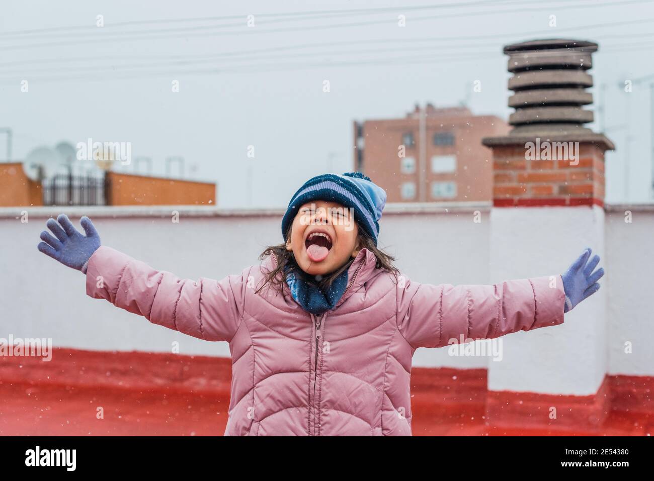 Girl catching snowflakes tongue hi-res stock photography and images - Alamy