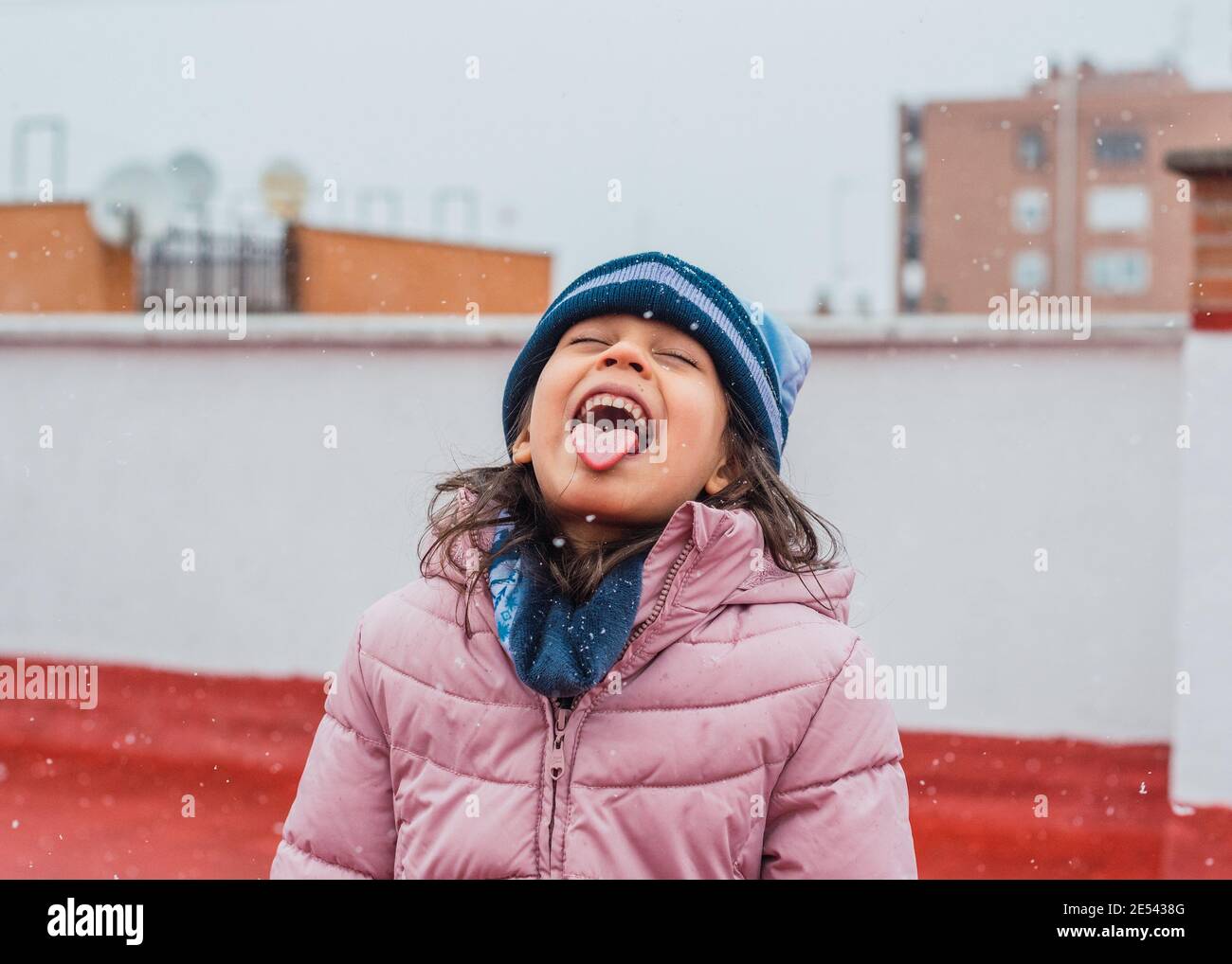 Girl catching snowflakes tongue hi-res stock photography and images - Alamy
