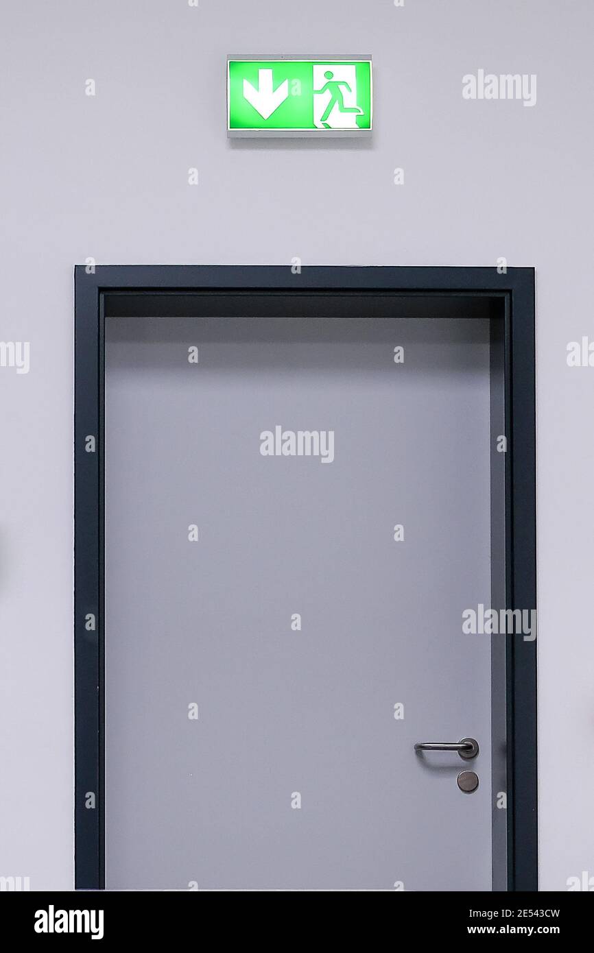 Green alert emergency escape sign lightbox above the door Stock Photo ...