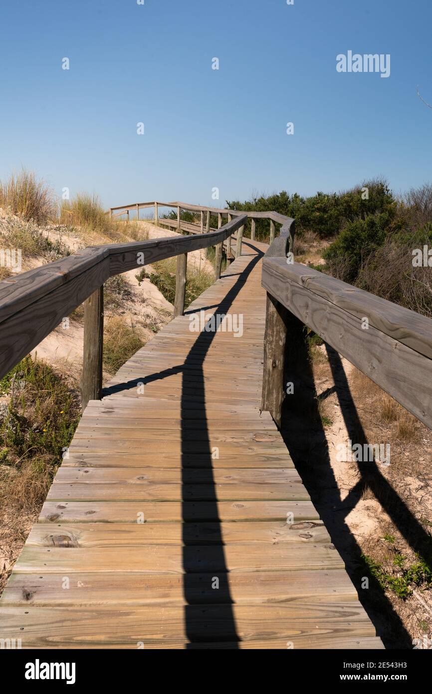 Wooden pathway with a handrail in Santa Lucia del Este Canelones beach ...