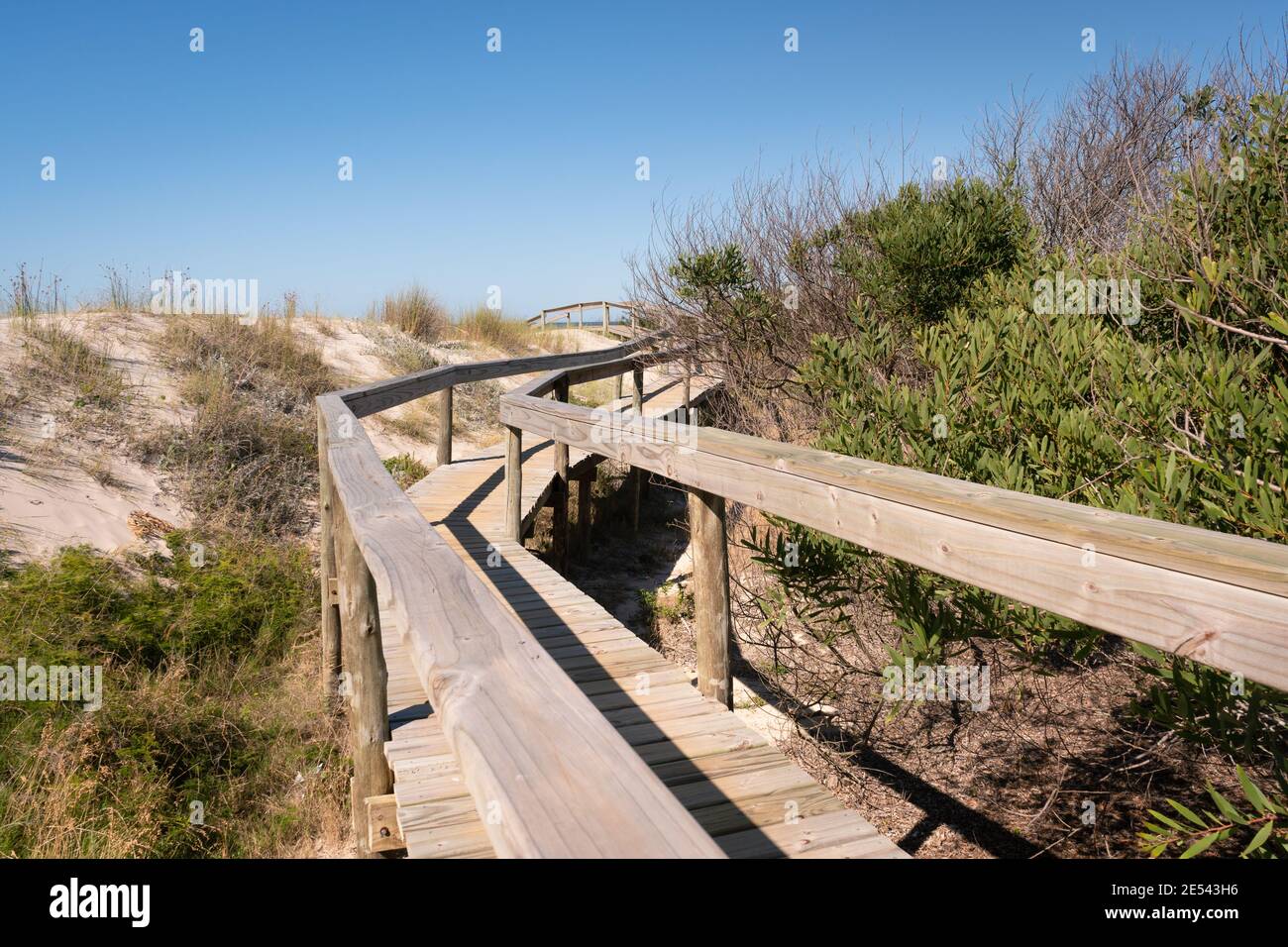 Wooden pathway with a handrail in Santa Lucia del Este Canelones beach ...