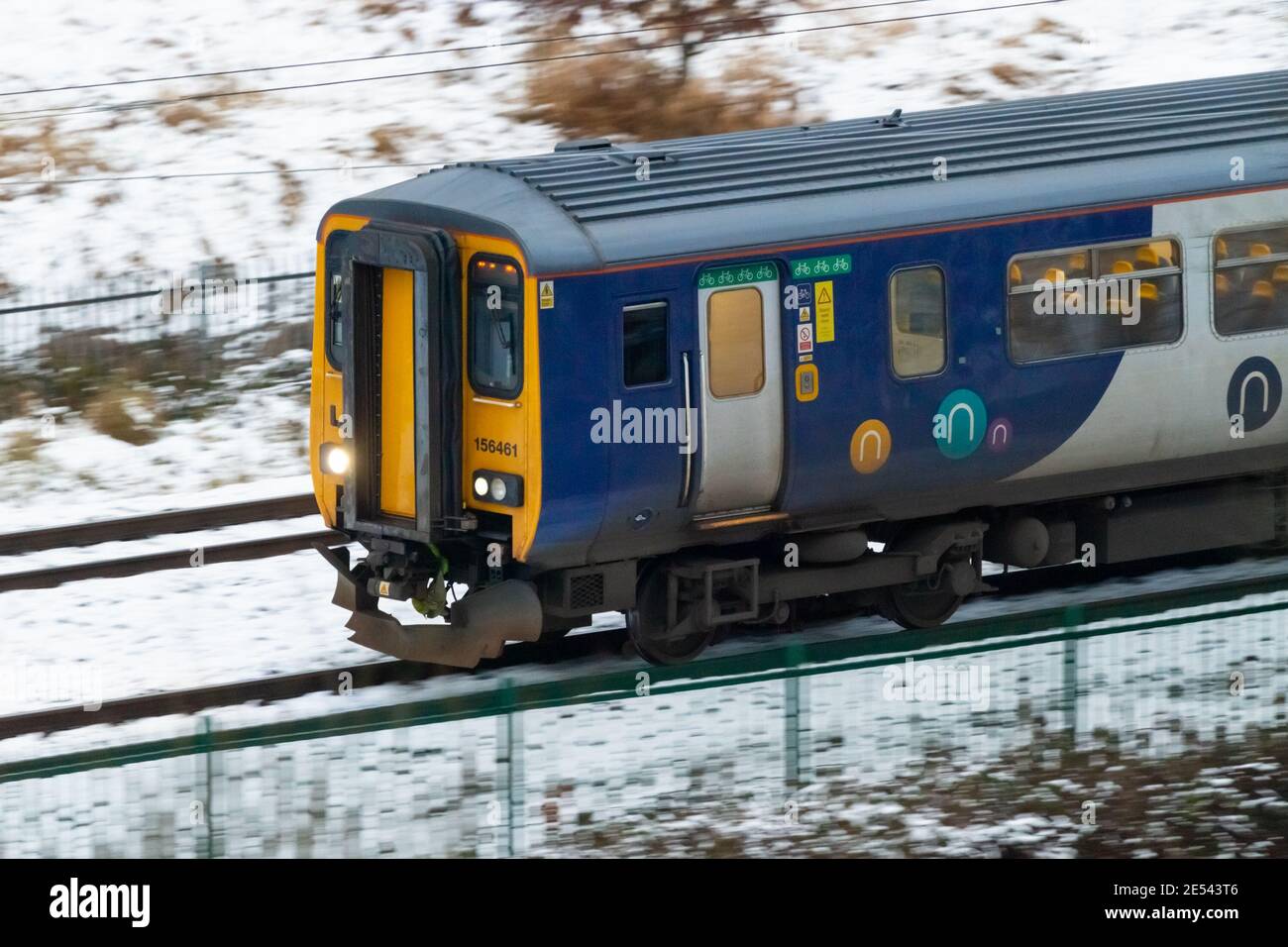 British Rail Class 156 DMU running between Lostock and Bolton station, a panned shot to capture ...