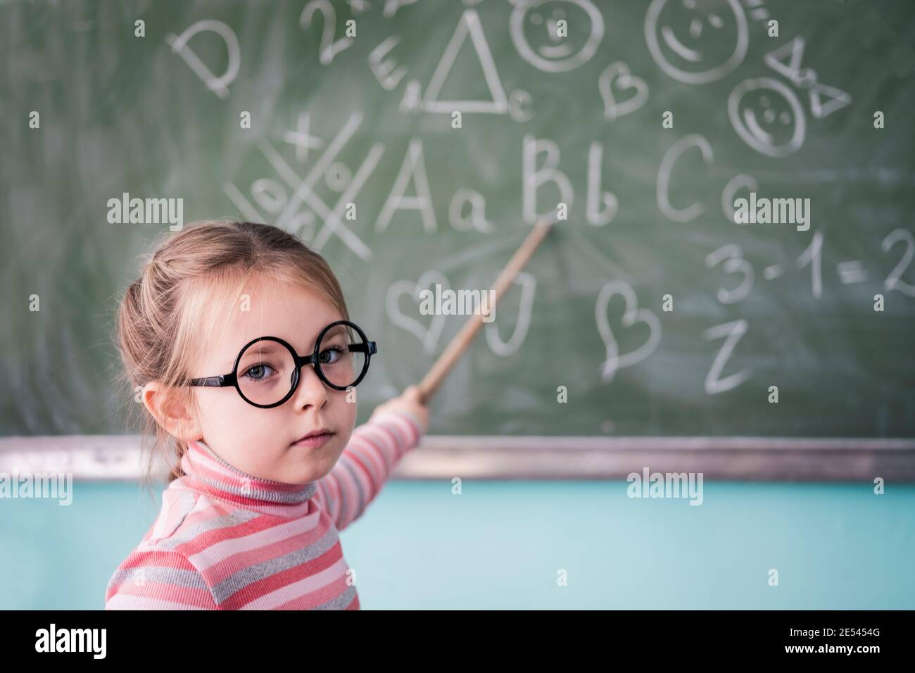 Child Girl Pointing School Blackboard. High quality photo Stock Photo ...