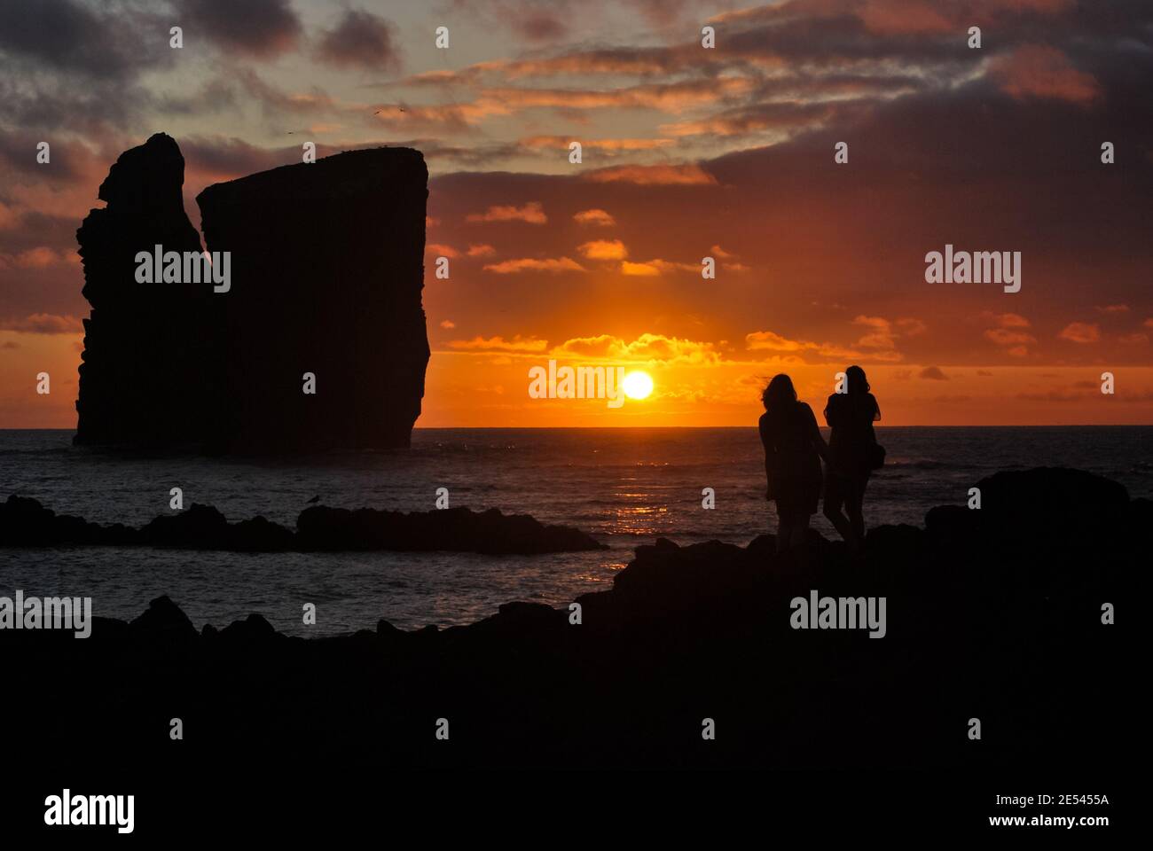 Silhouette of two people, during sunset, in Mosteiros, Sao Miguel ...