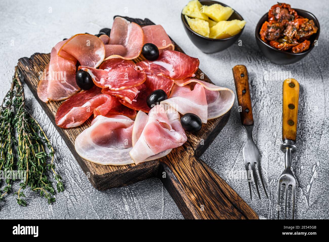 Cured meat platter of traditional Spanish tapas. White background. Top ...