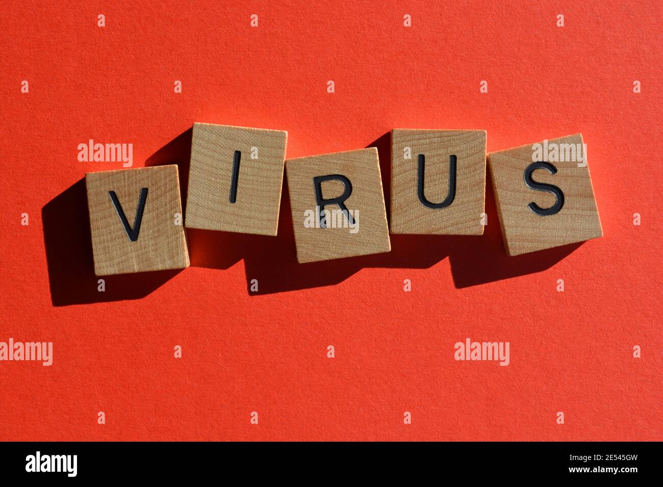 Virus, word in wooden alphabet letters isolated on bright red ...
