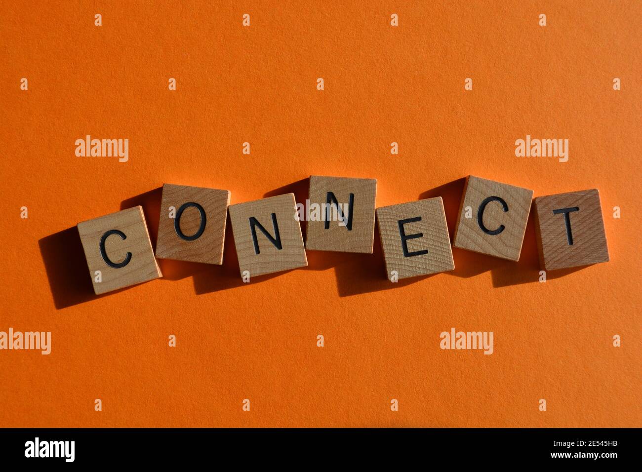 Connect, word in wooden alphabet letters isolated on bright orange ...